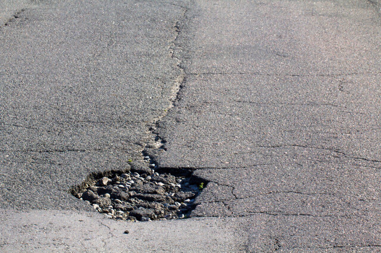 Winter Asphalt Damage: When to Repair vs. Replace - Doctor Asphalt